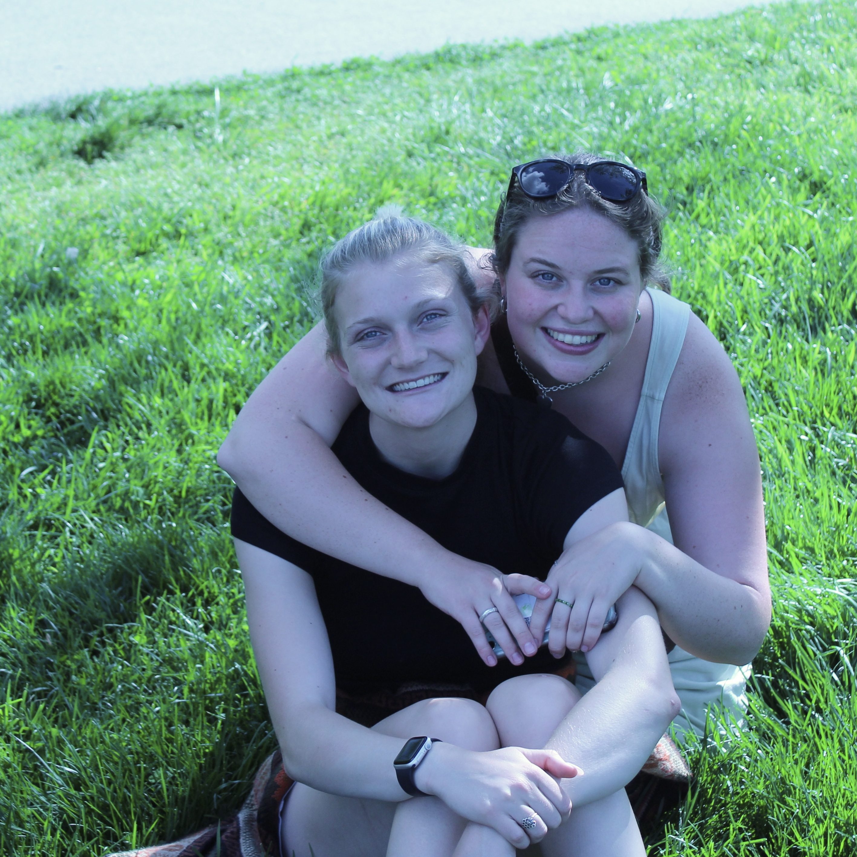 Beatrice Roussell ‘24 and Louise Dellarco ‘26 sit on the National Mall ...