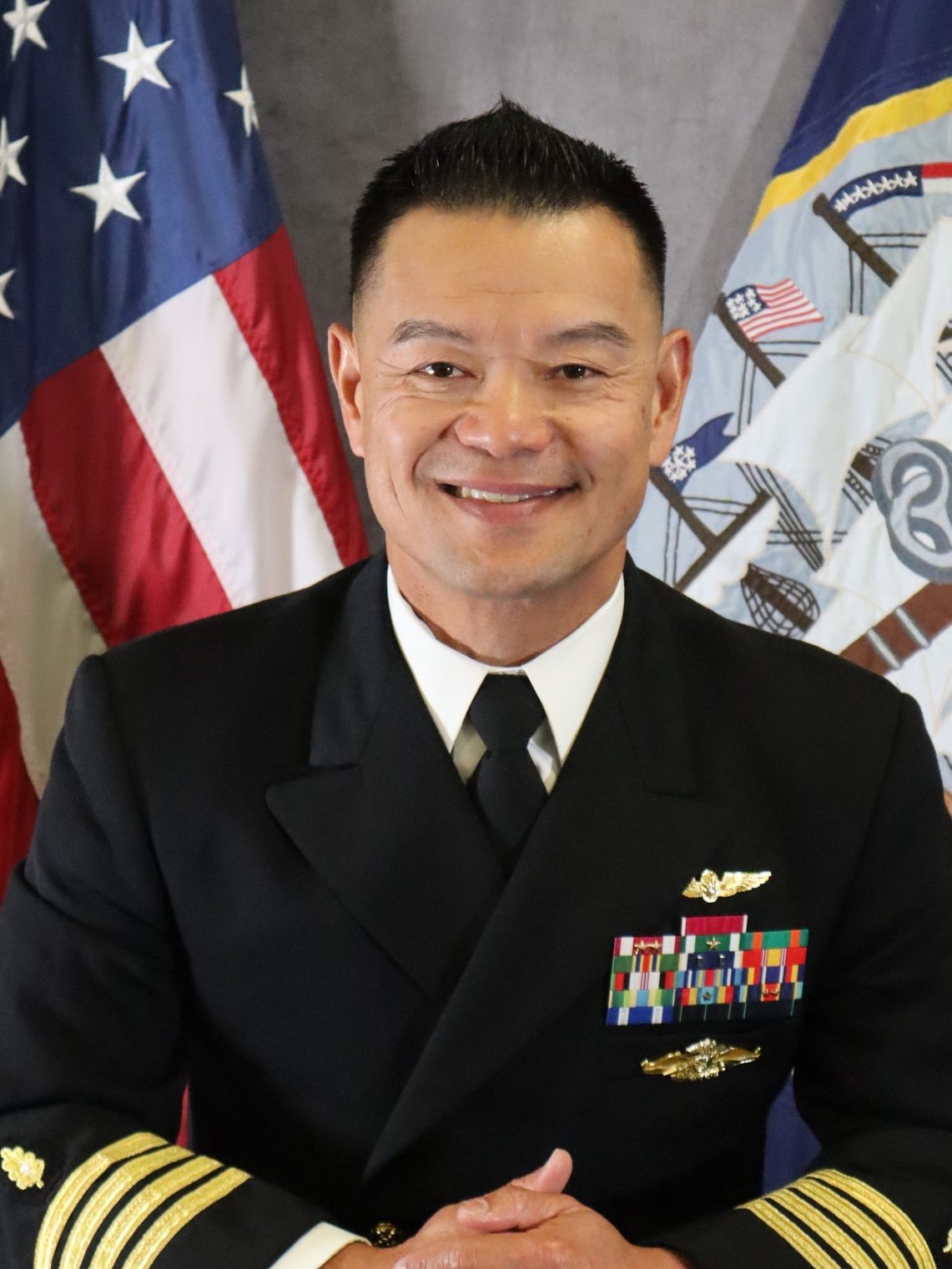 Bio Photos w/ Banners – CAPT Nguyen (2) – The Peak